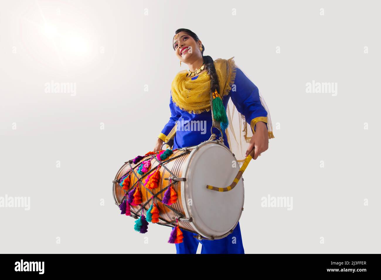 Portrait of Sikh woman playing drum during Baisakhi celebration Stock ...