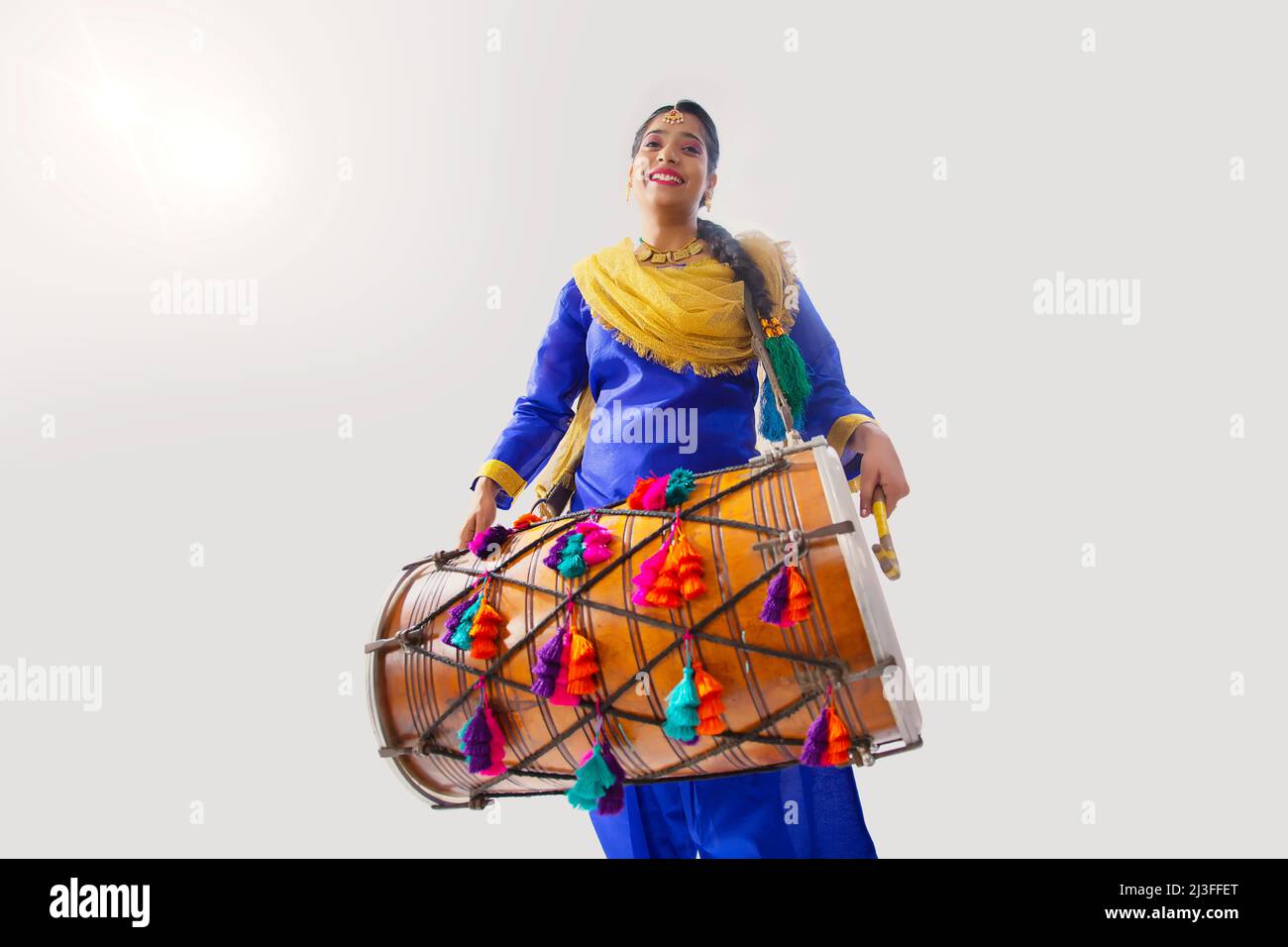 Portrait of Sikh woman playing drum during Baisakhi celebration Stock ...