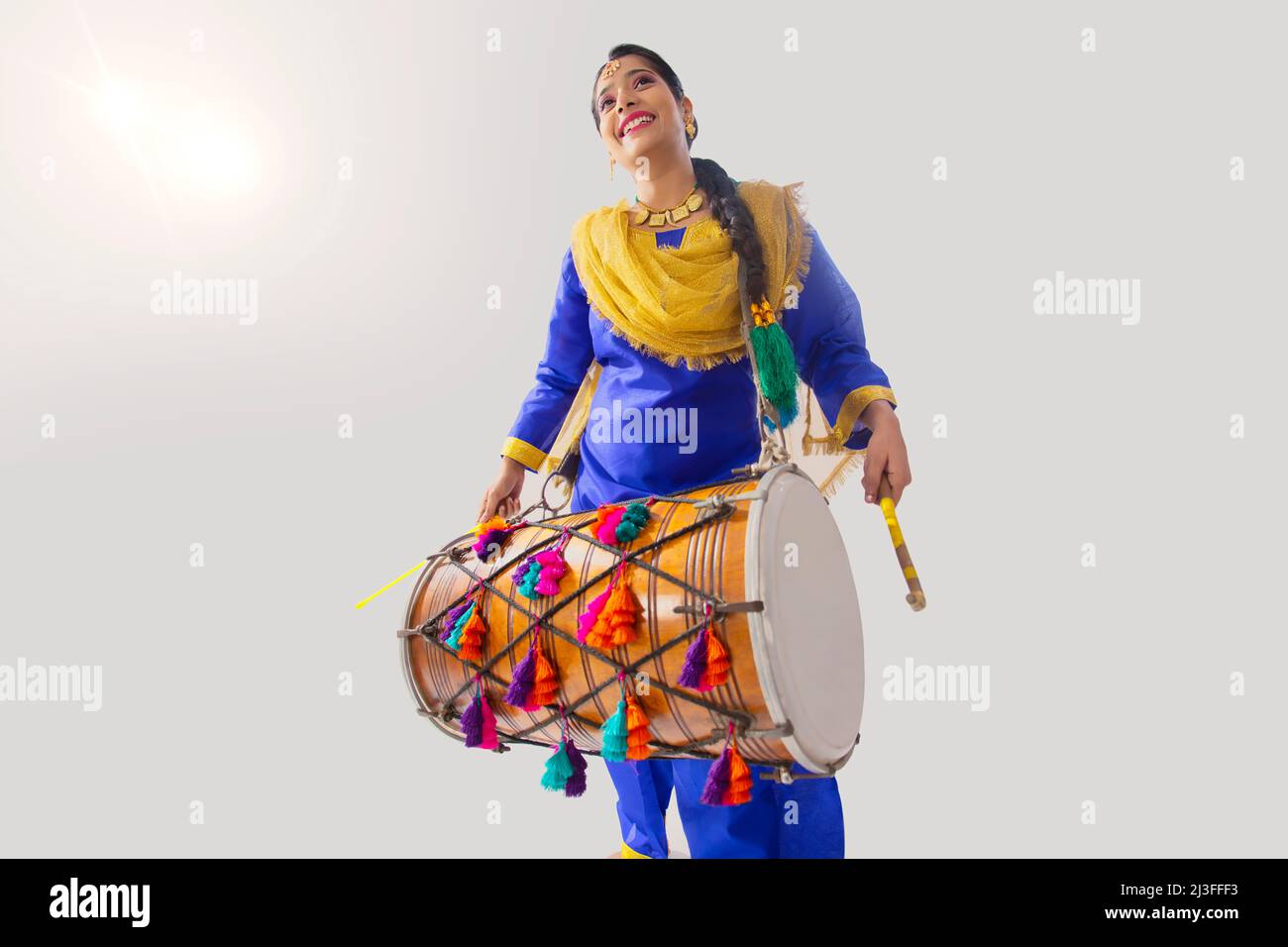Portrait of Sikh woman playing drum during Baisakhi celebration Stock ...