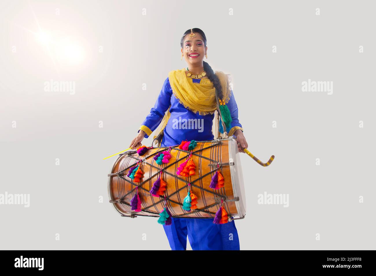 Portrait of Sikh woman playing drum during Baisakhi celebration Stock ...