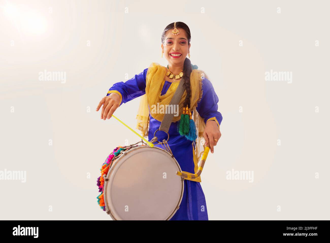 Portrait of Sikh woman playing drum during Baisakhi celebration Stock ...