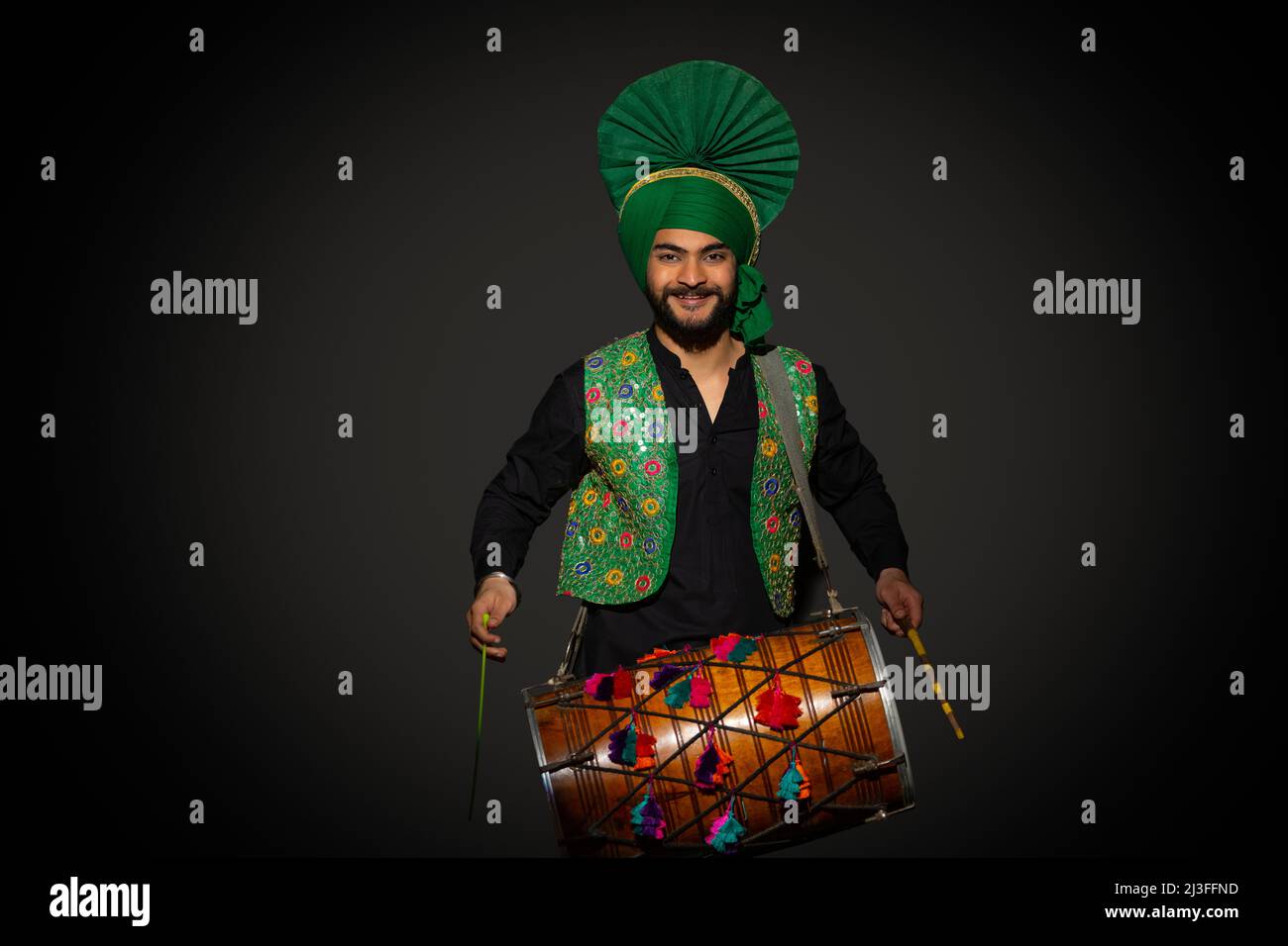 Portrait of Sikh man playing drum during Baisakhi celebration Stock ...