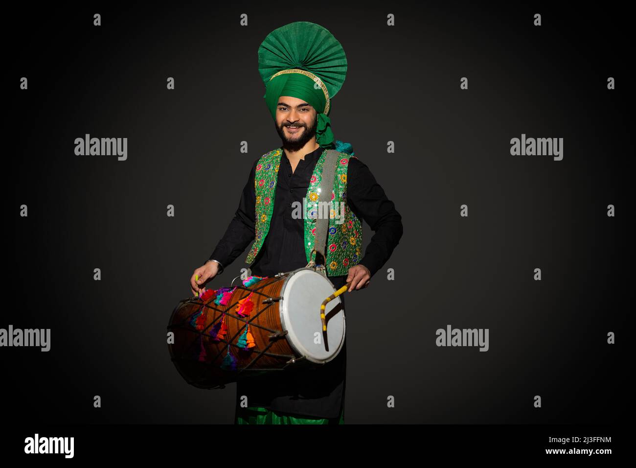 Portrait of Sikh man playing drum during Baisakhi celebration Stock ...