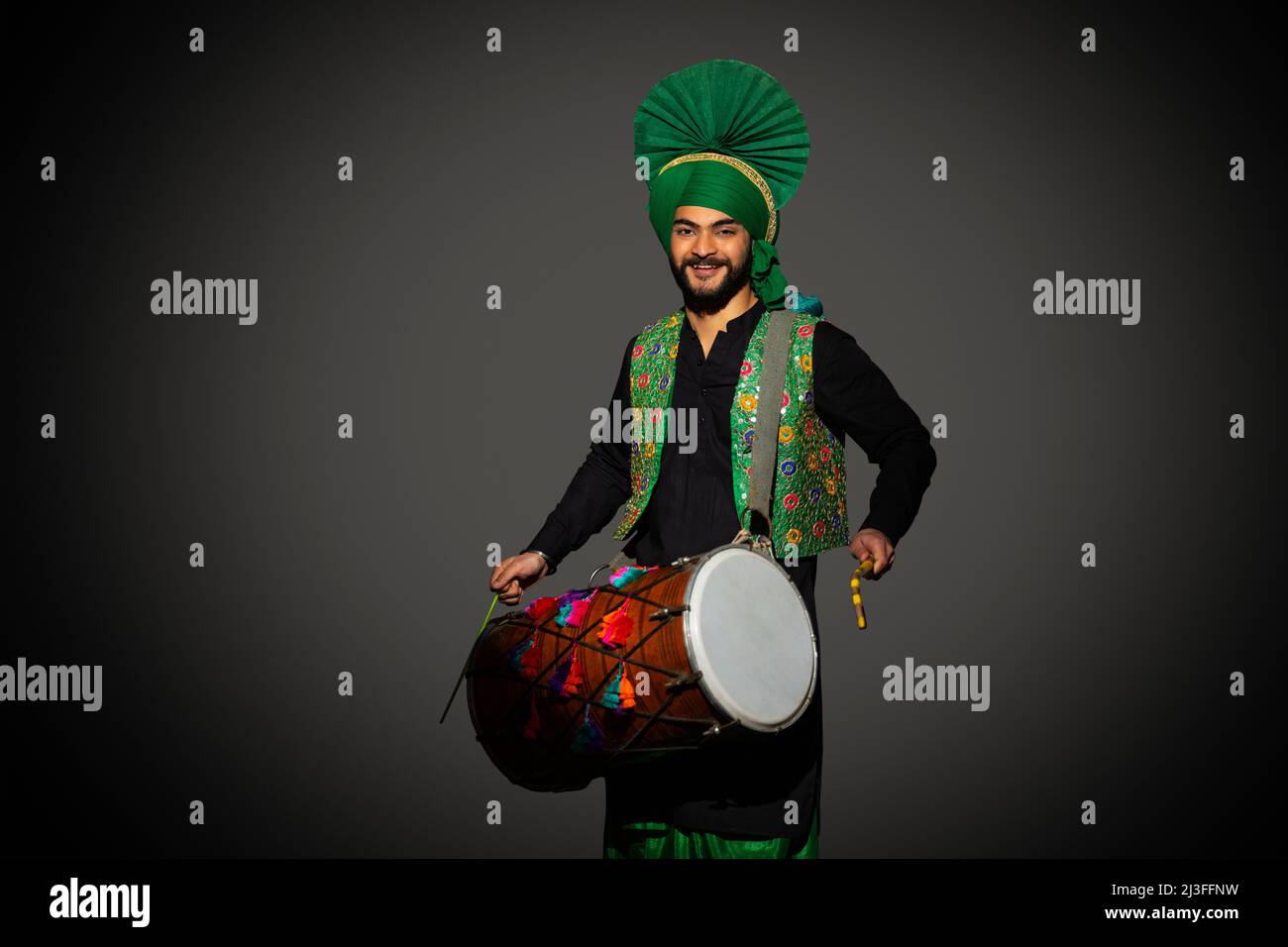 Portrait of Sikh man playing drum during Baisakhi celebration Stock ...