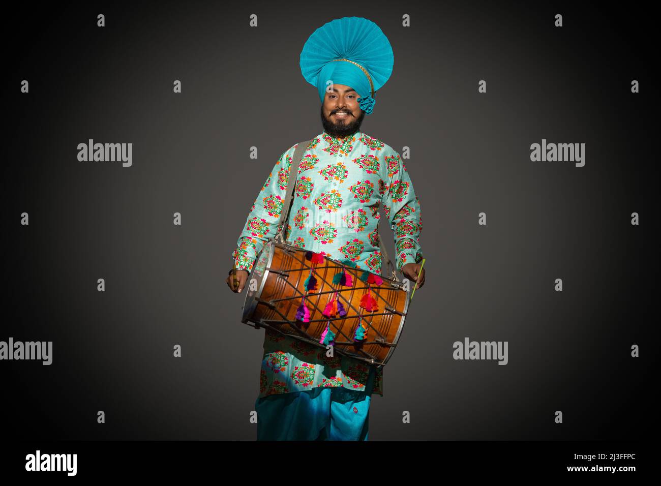Portrait of Sikh man playing drum during Baisakhi celebration Stock ...