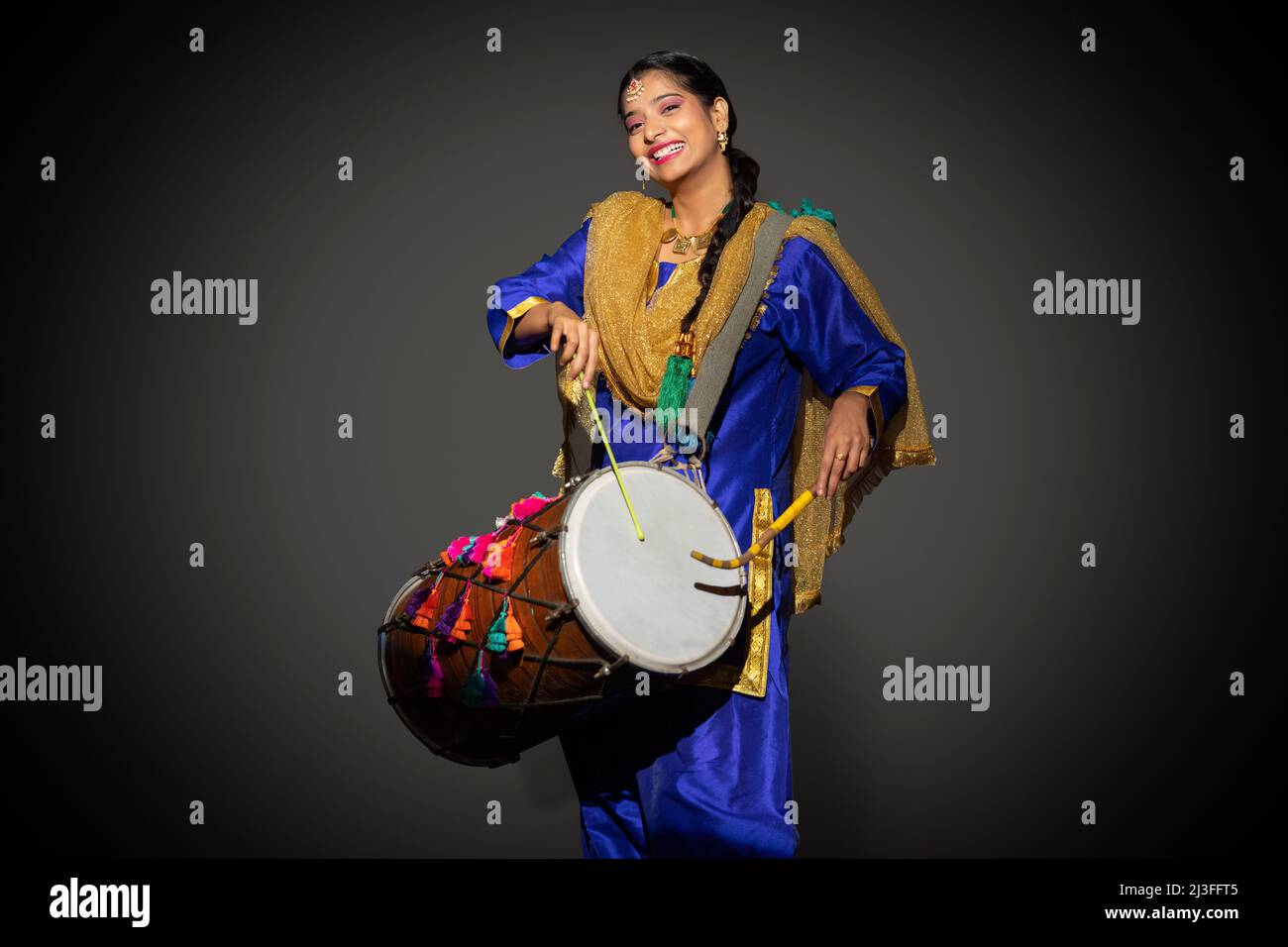 Portrait of Sikh woman playing drum during Baisakhi celebration Stock ...