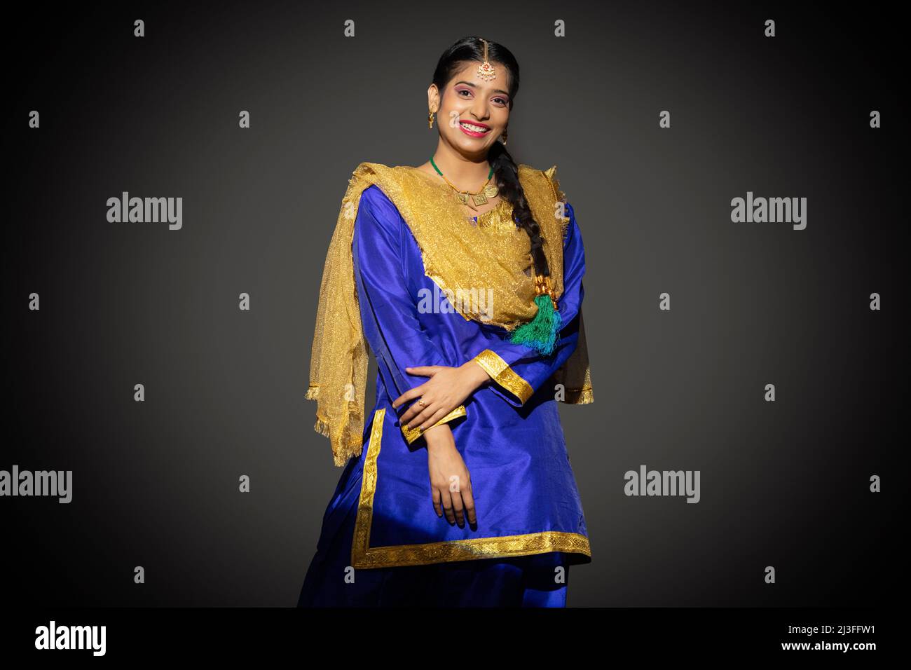 Portrait of a happy Sikh woman posing in front of camera Stock Photo ...