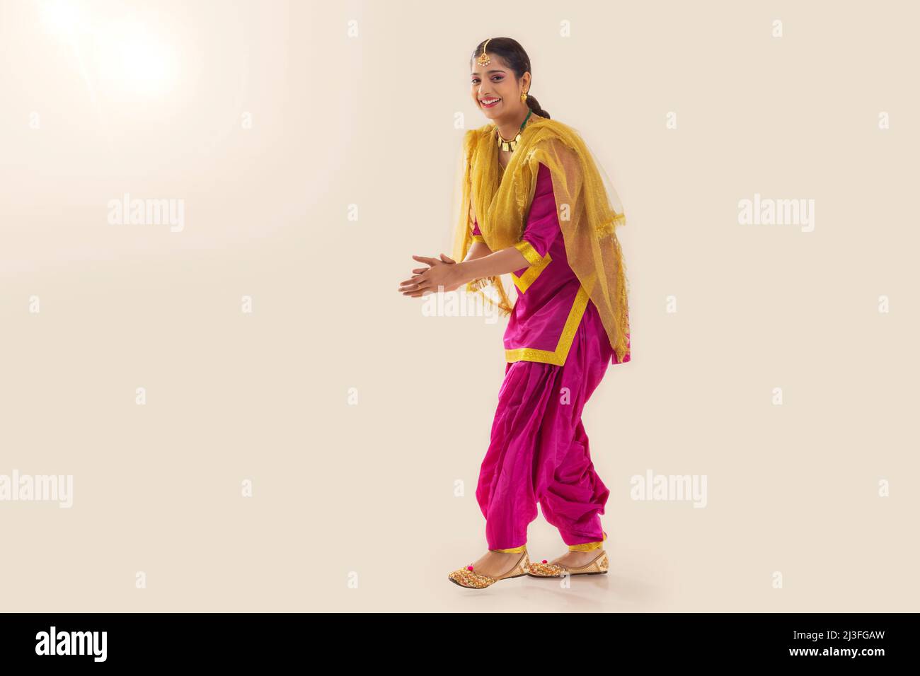 Sikh Woman performing bhangra during Baisakhi Celebration Stock Photo ...