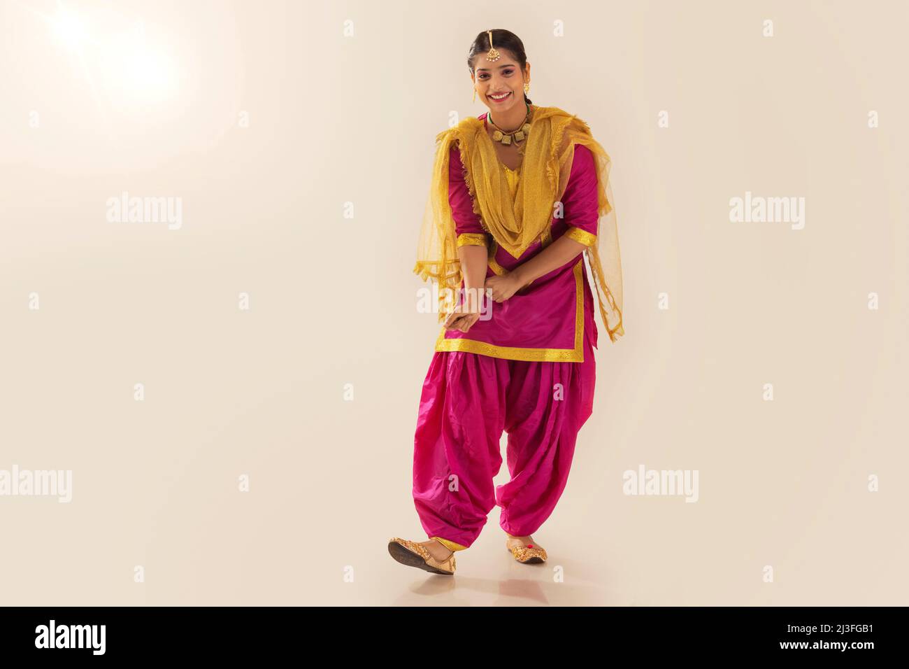 Sikh Woman performing bhangra during Baisakhi Celebration Stock Photo ...