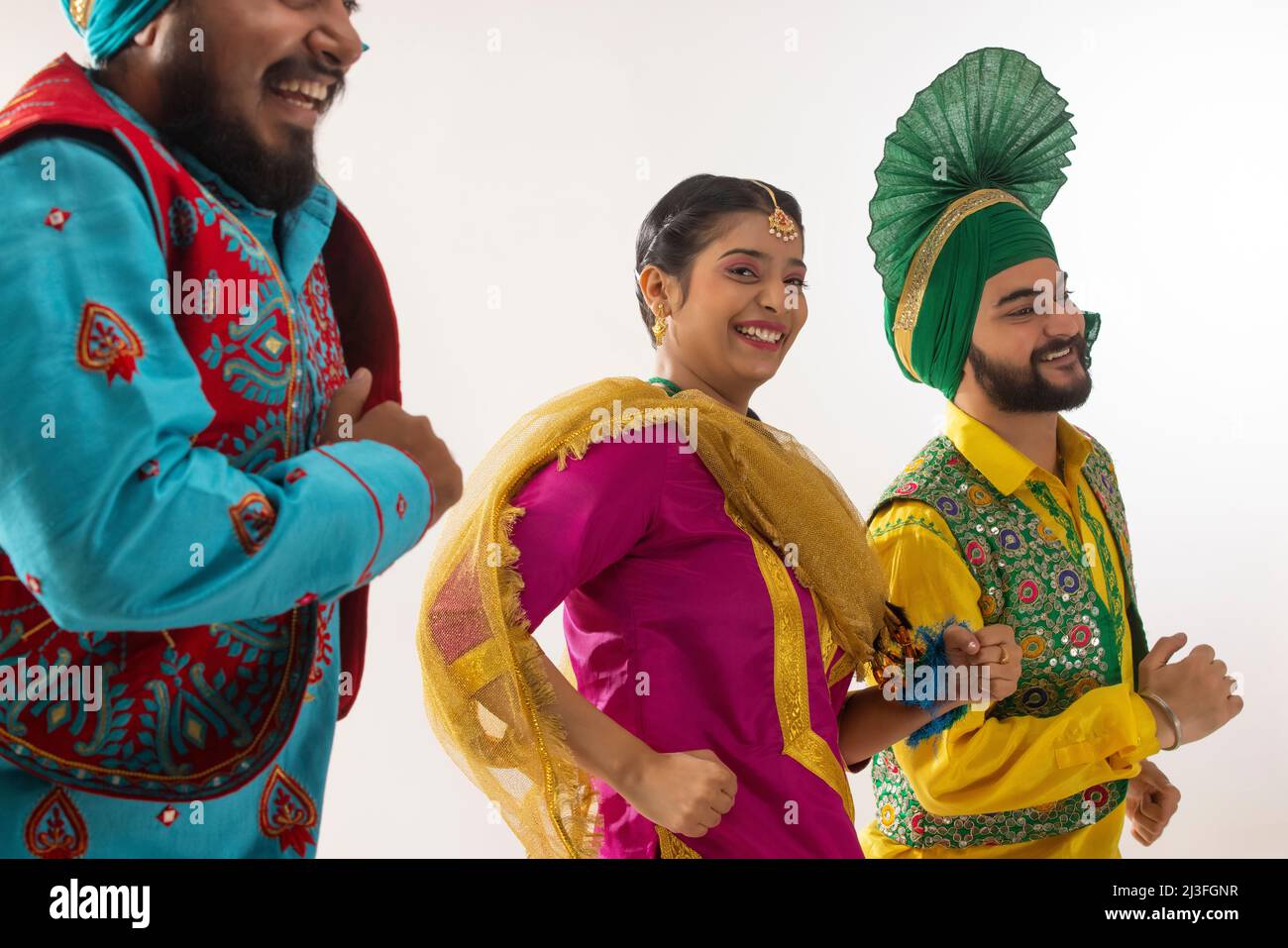 Sikh people performing bhangra together during Baisakhi celebration ...