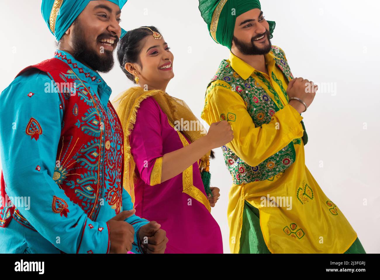 Sikh people performing bhangra together during Baisakhi celebration ...