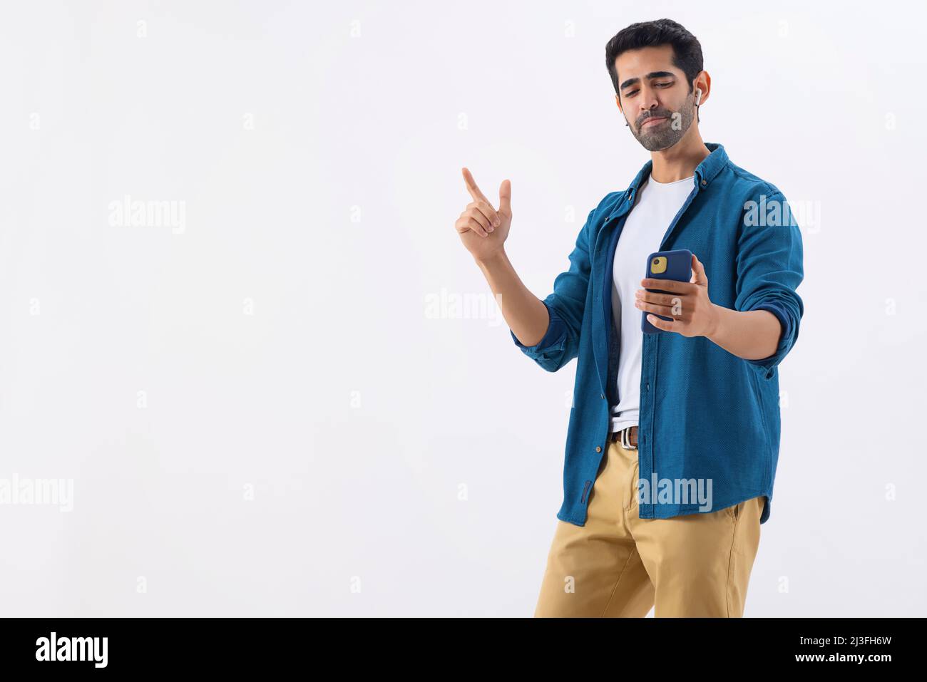 Young man dancing smartphone hi-res stock photography and images - Alamy