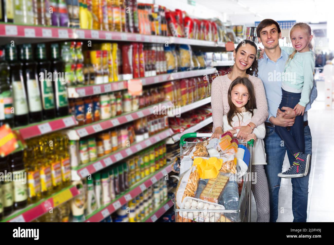 parents with kids and purchases Stock Photo - Alamy