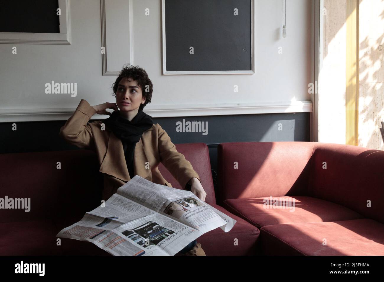 Female model in a cafe Stock Photo - Alamy