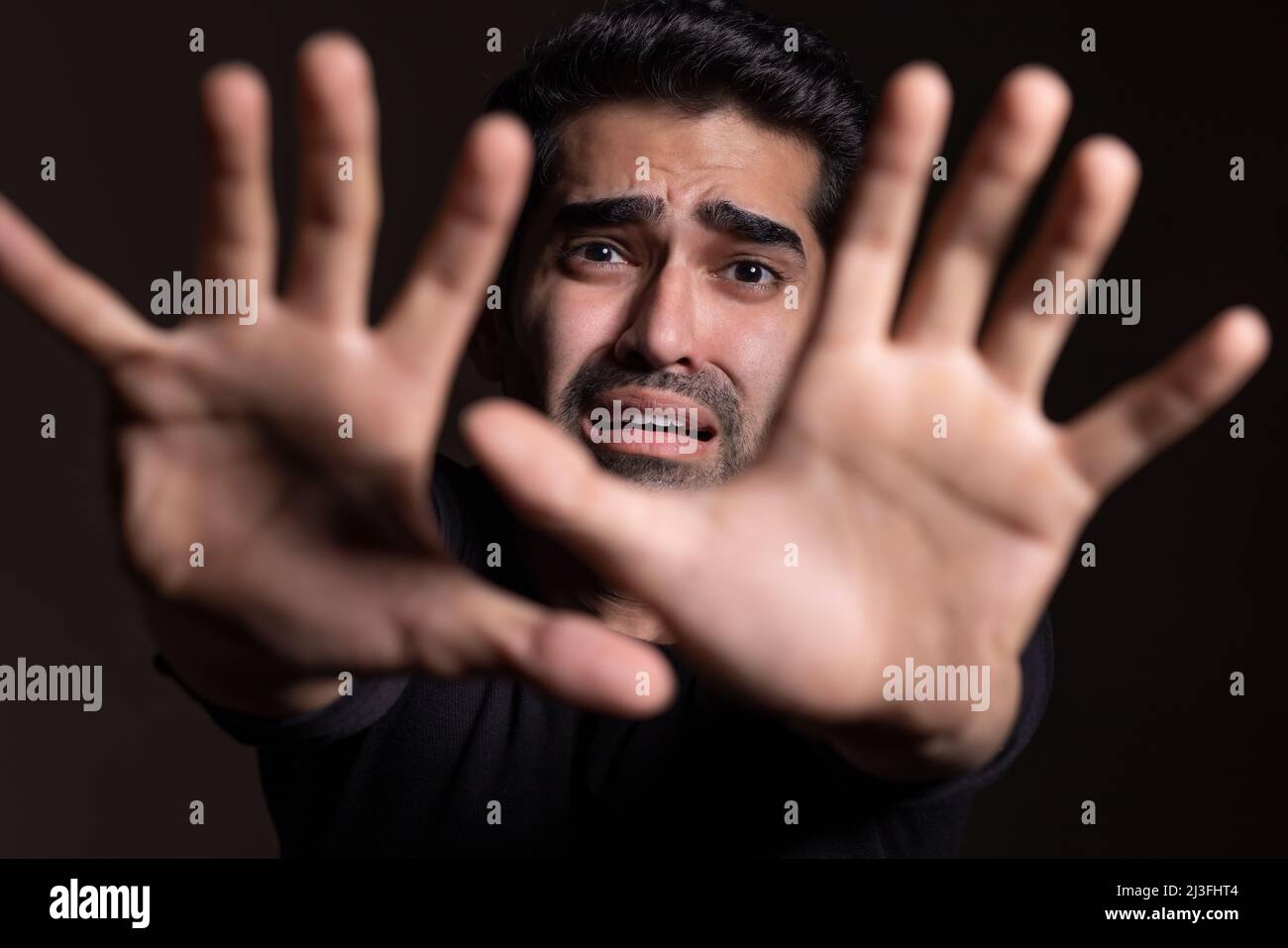 Man frightened crying hi-res stock photography and images - Alamy