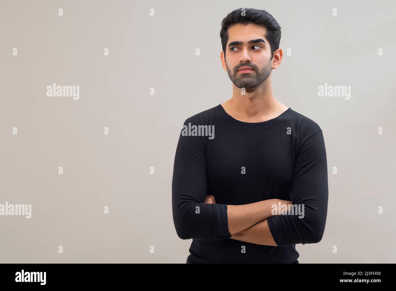 Portrait of a young man looking elsewhere with crossed eyes Stock Photo ...