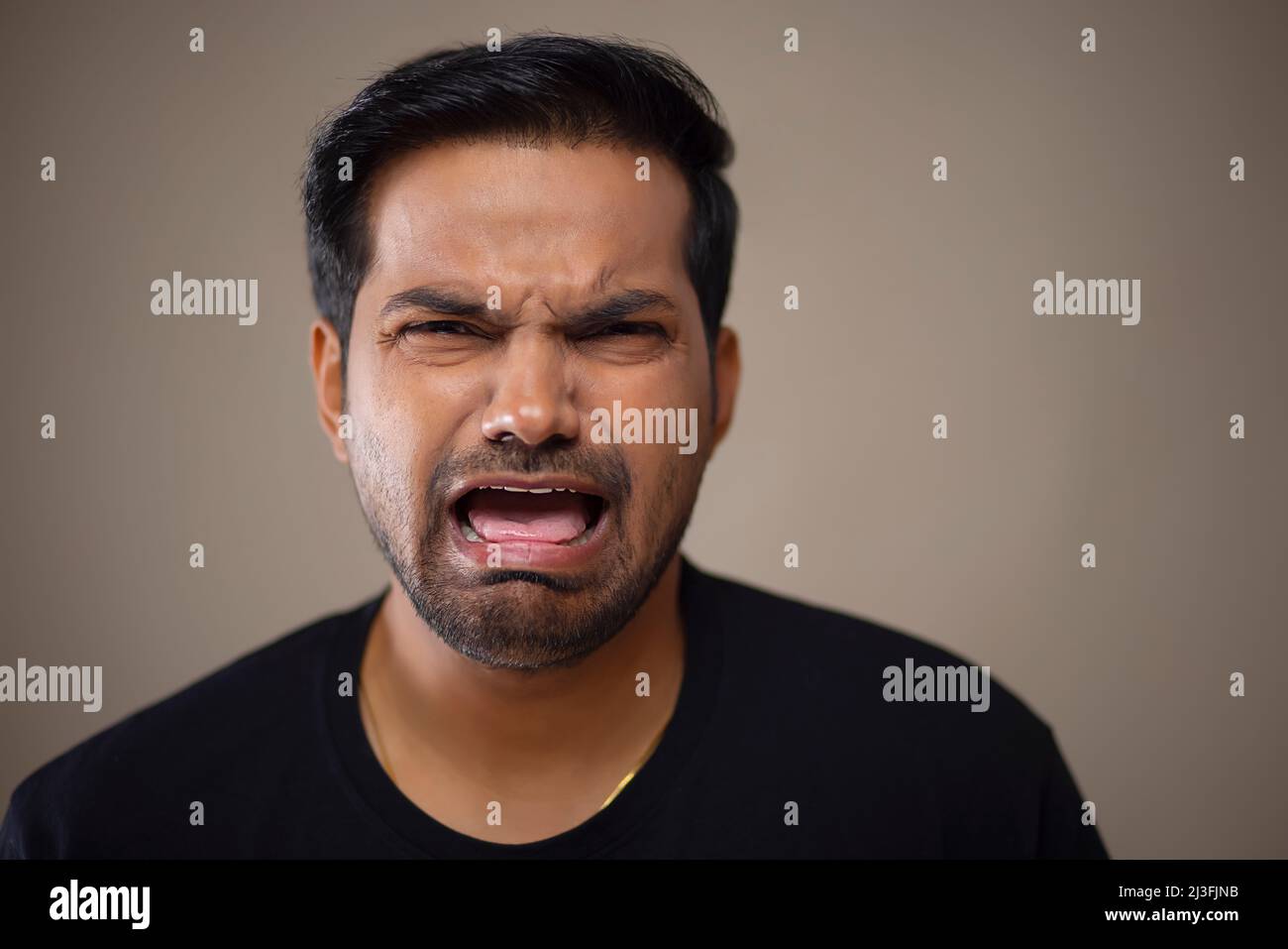 Portrait of a young man crying in front of camera Stock Photo - Alamy