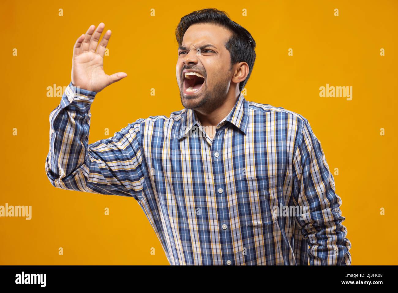Young man shouting and calling someone far away Stock Photo - Alamy