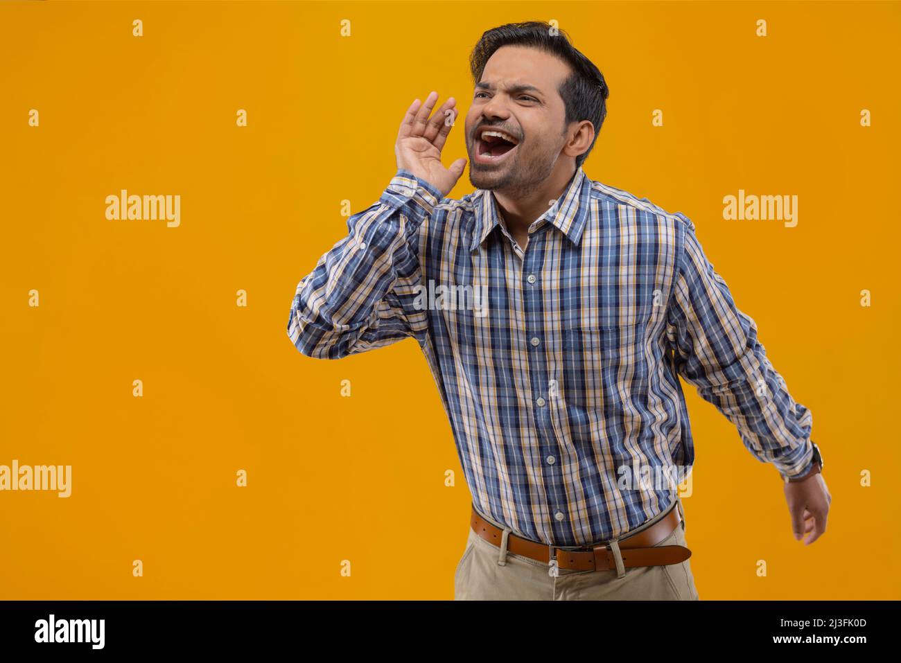 Young man shouting and calling someone far away Stock Photo - Alamy