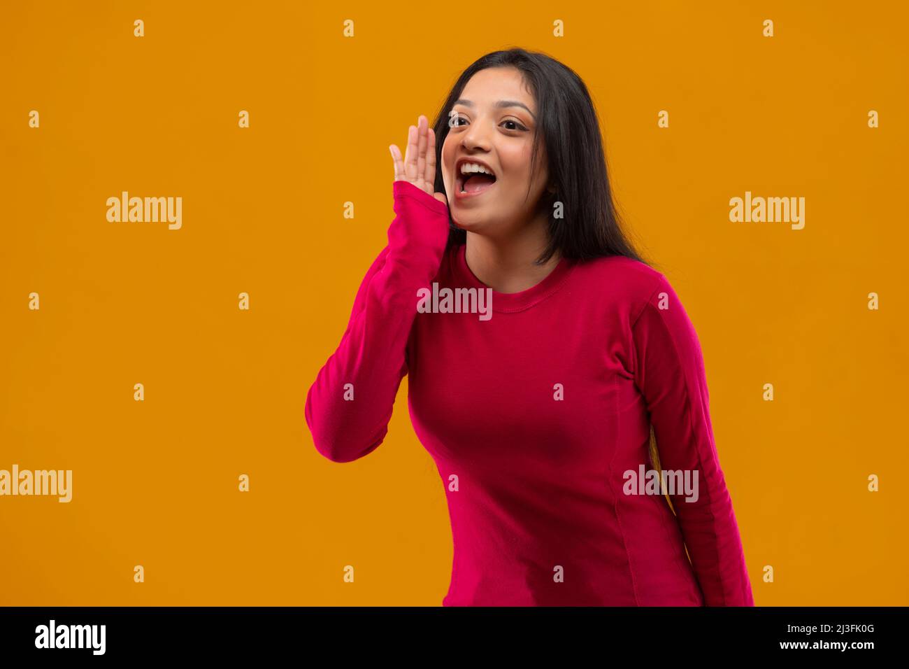 Young woman shouting and calling someone far away Stock Photo - Alamy