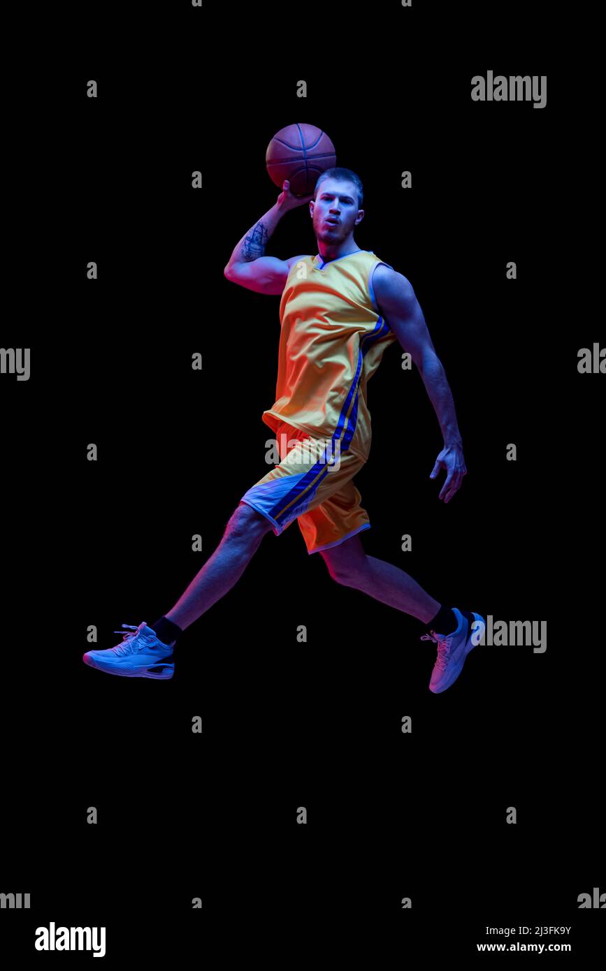 Portrait of sportive man, professional basketball player playing ...
