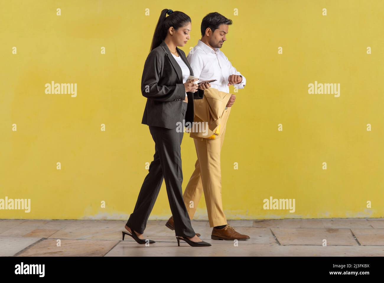 Portrait of a young corporate couple in formal outfit Stock Photo - Alamy