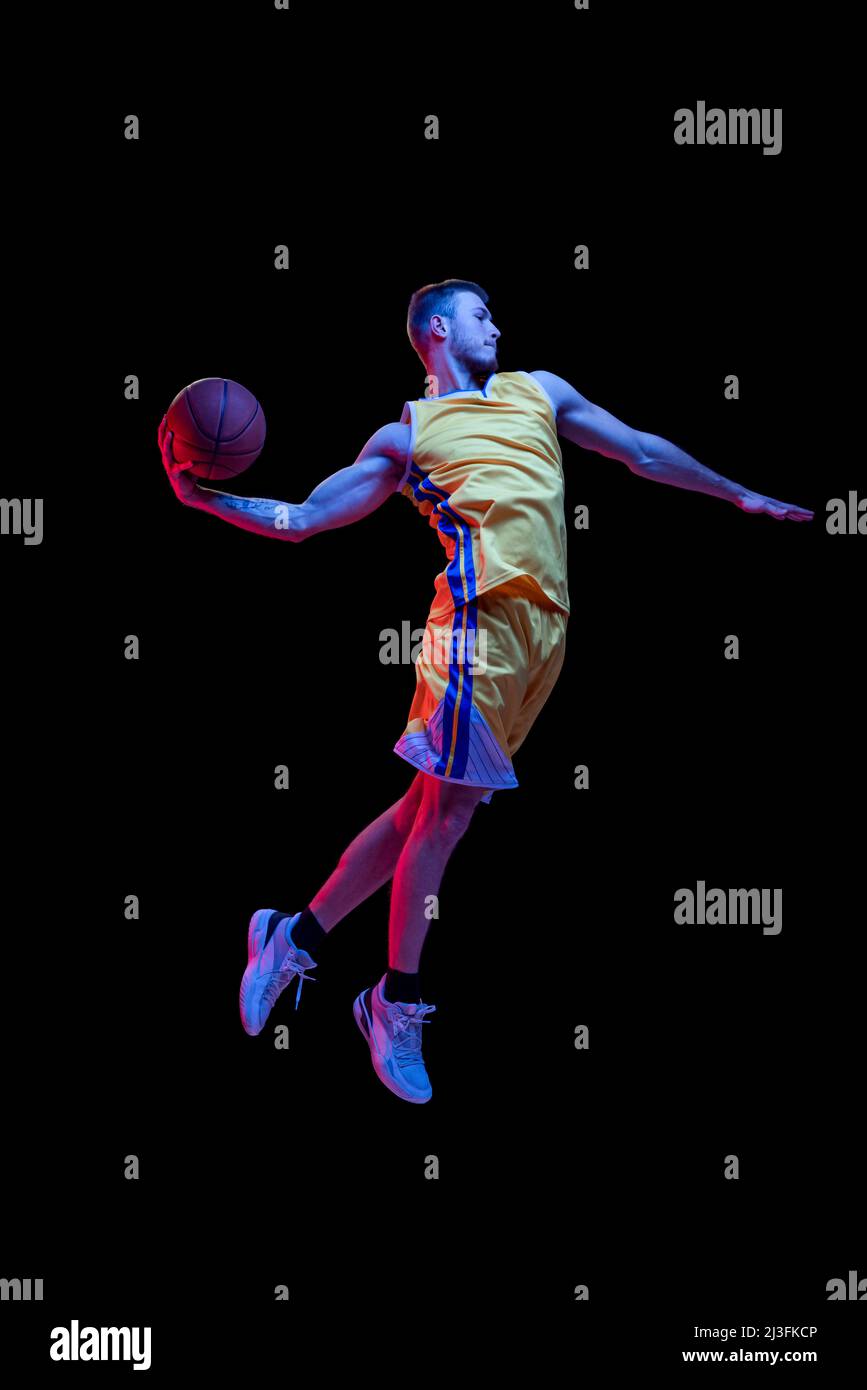 Portrait of sportive man, professional basketball player playing ...