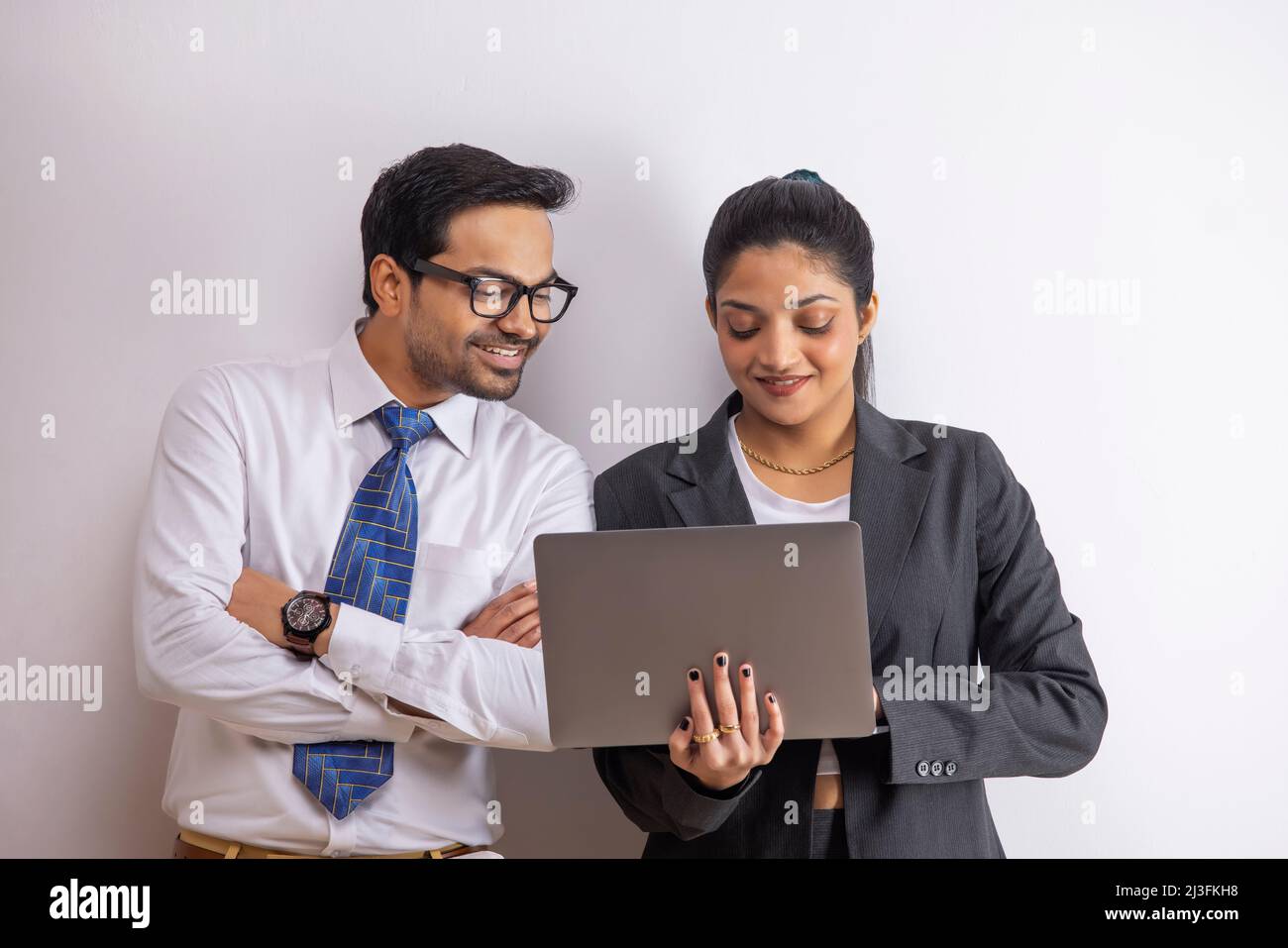 Office colleagues together doing office work using laptop Stock Photo ...
