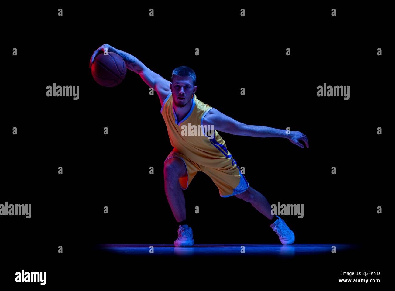 Portrait of sportive man, professional basketball player playing ...