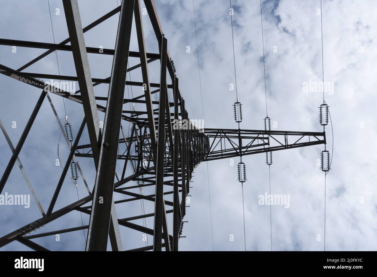 Massive tall high voltage mast pylon photographed sideways from bottom ...