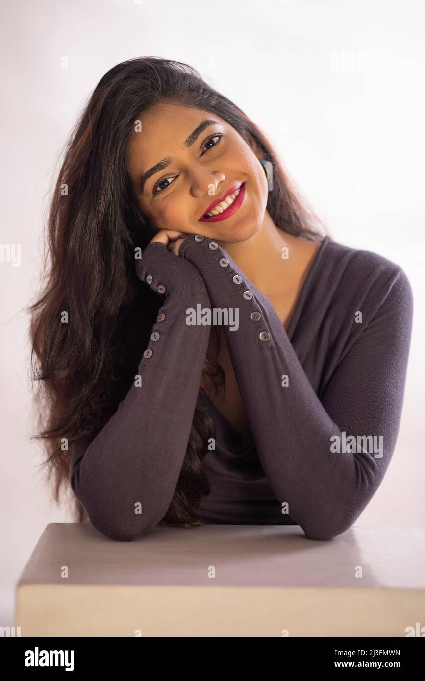 Resting chin on hands hi-res stock photography and images - Alamy