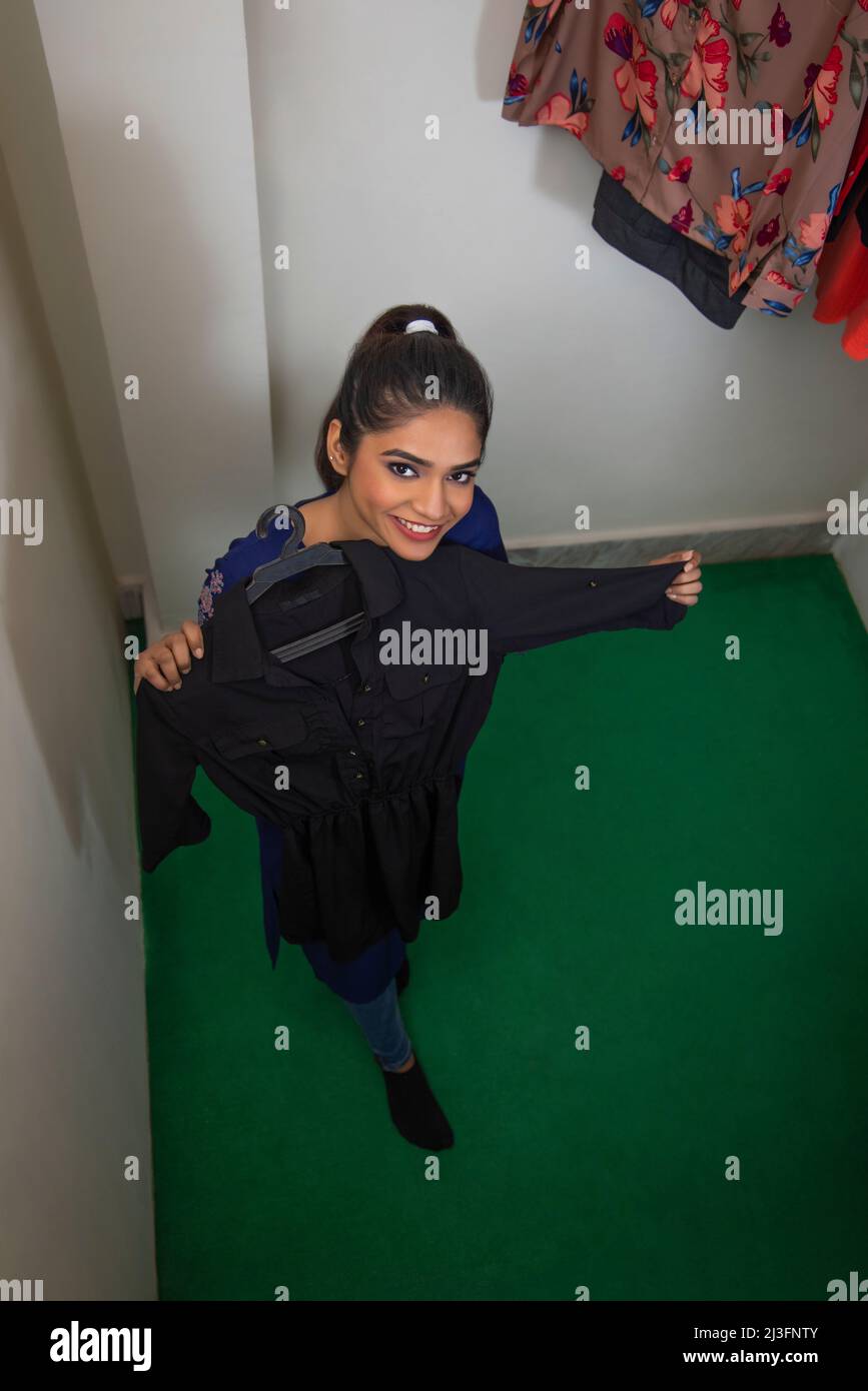 Top view of a woman in trial room with new dress Stock Photo - Alamy