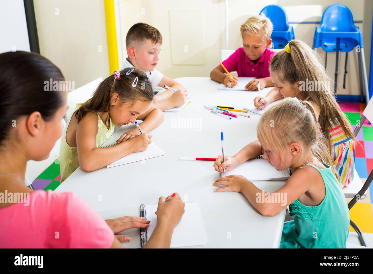 Excited children writing hi-res stock photography and images - Alamy