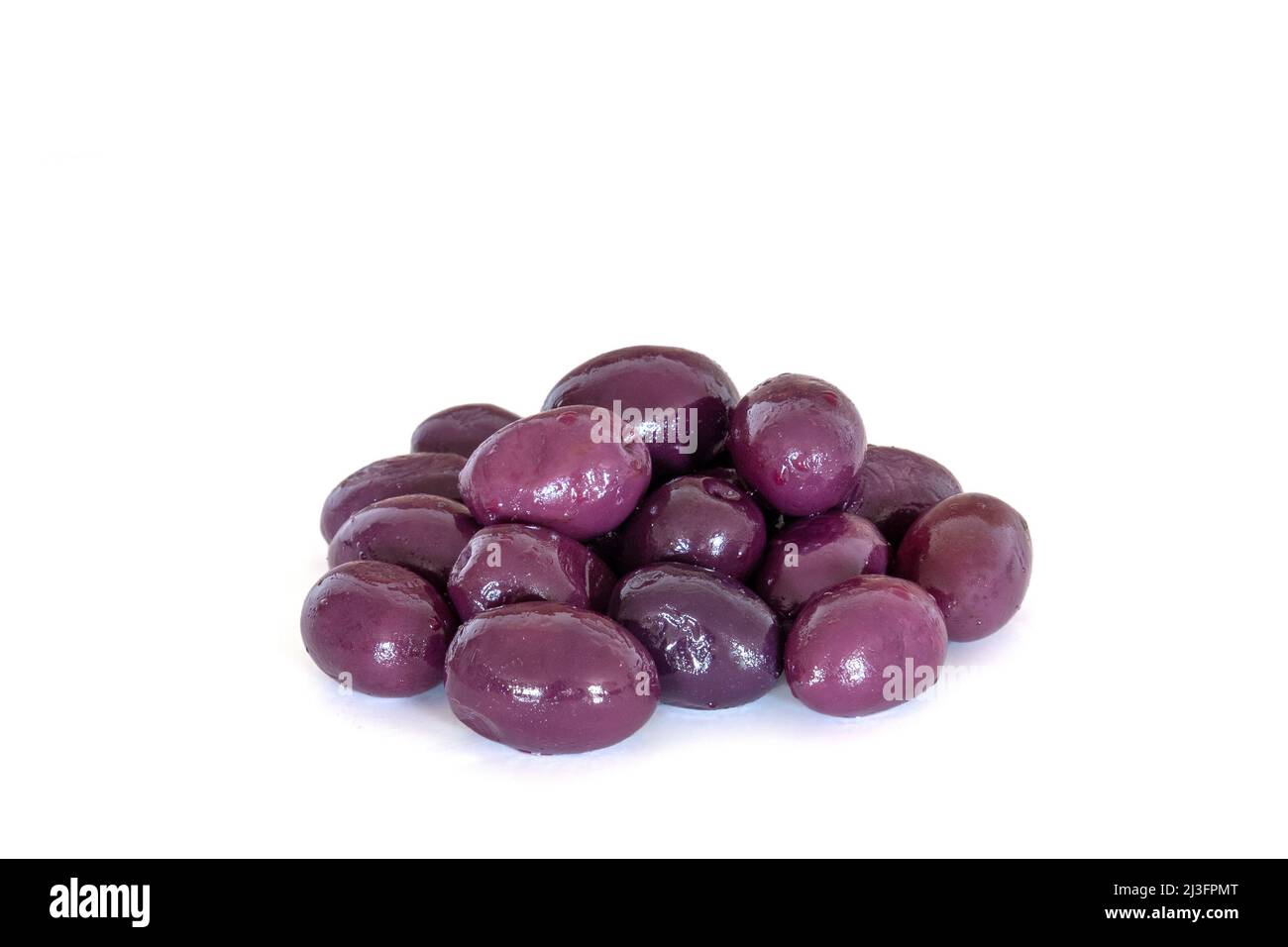 pile of purple olives isolated on a white background Stock Photo - Alamy