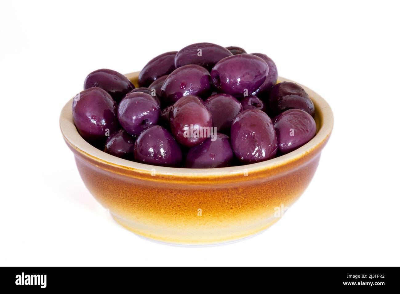 purple olives in a bowl isolated on a white background Stock Photo - Alamy