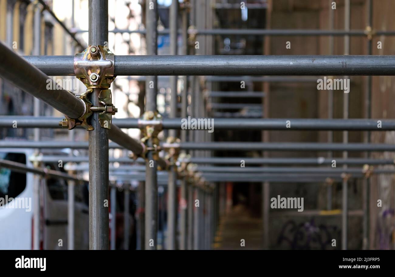 Construction to hold the scaffolding on a building in Naples, Italy ...