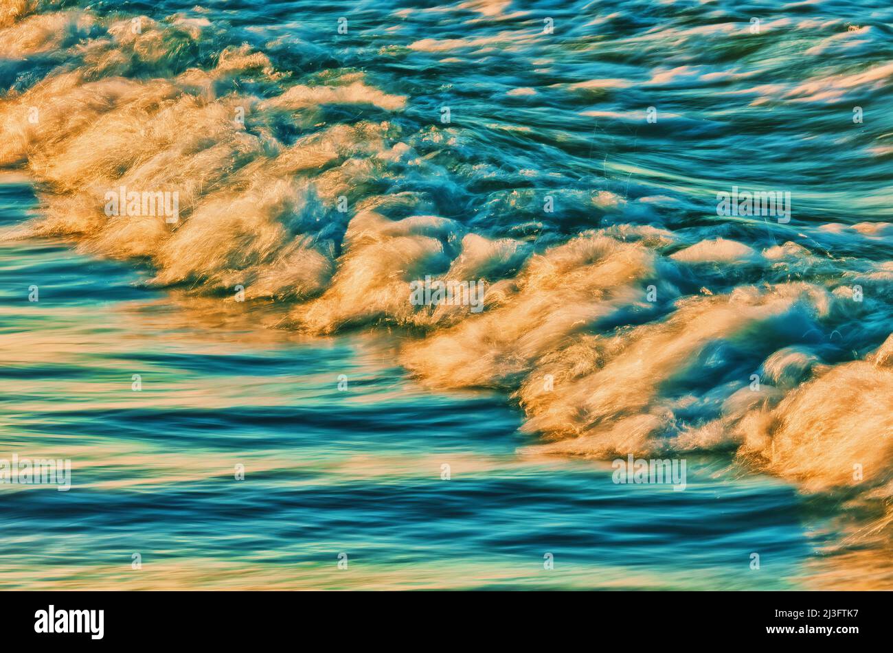 Whitewater wave rolling into the shore Stock Photo - Alamy