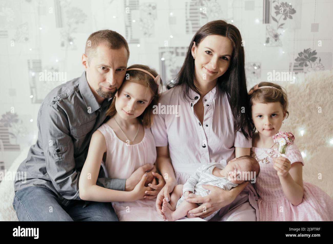 happy married couple with their three children Stock Photo - Alamy