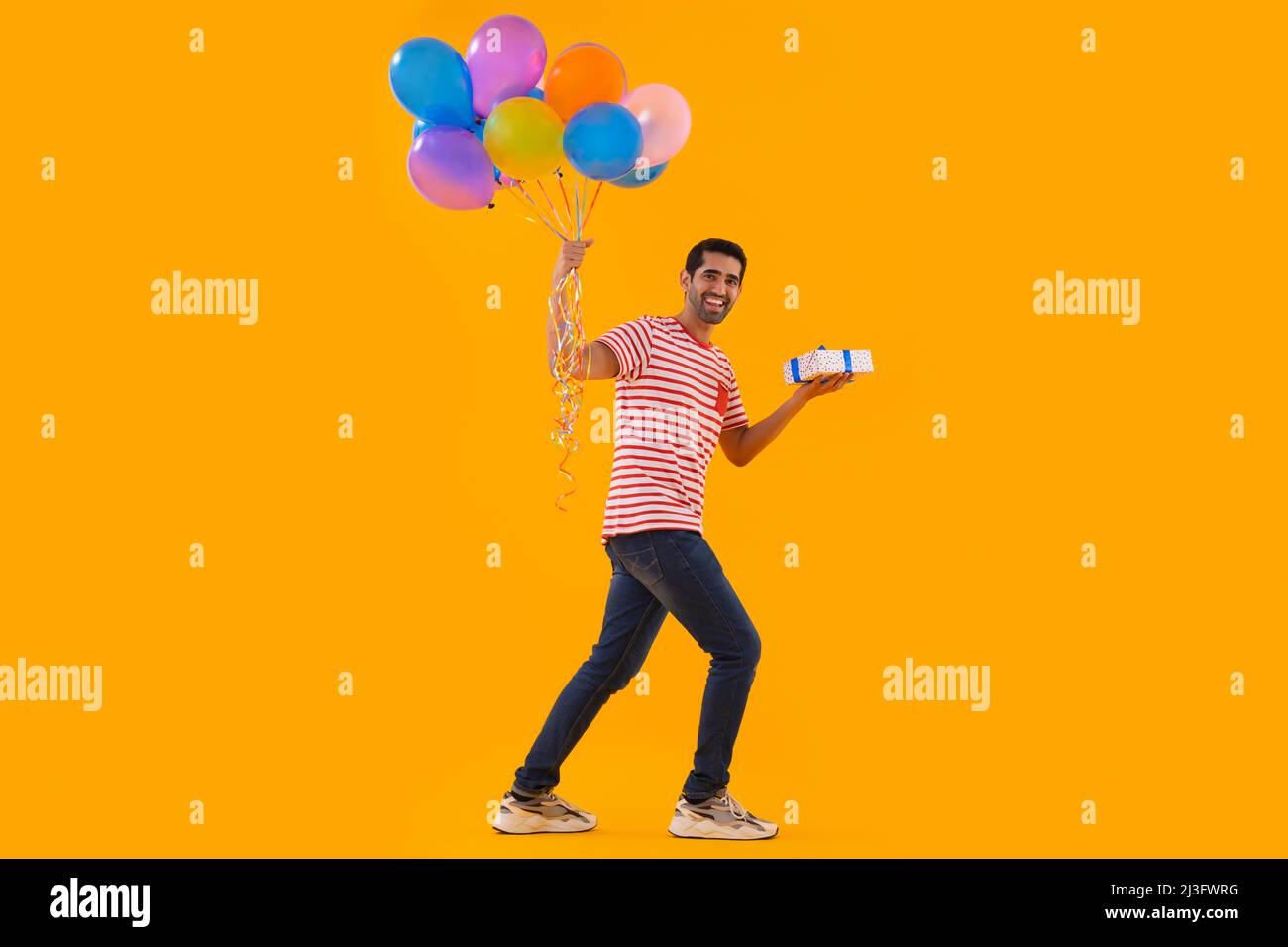 Standing man with balloons hi-res stock photography and images - Alamy