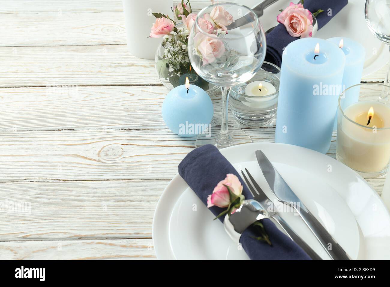 Concept of table setting with aroma candles Stock Photo - Alamy