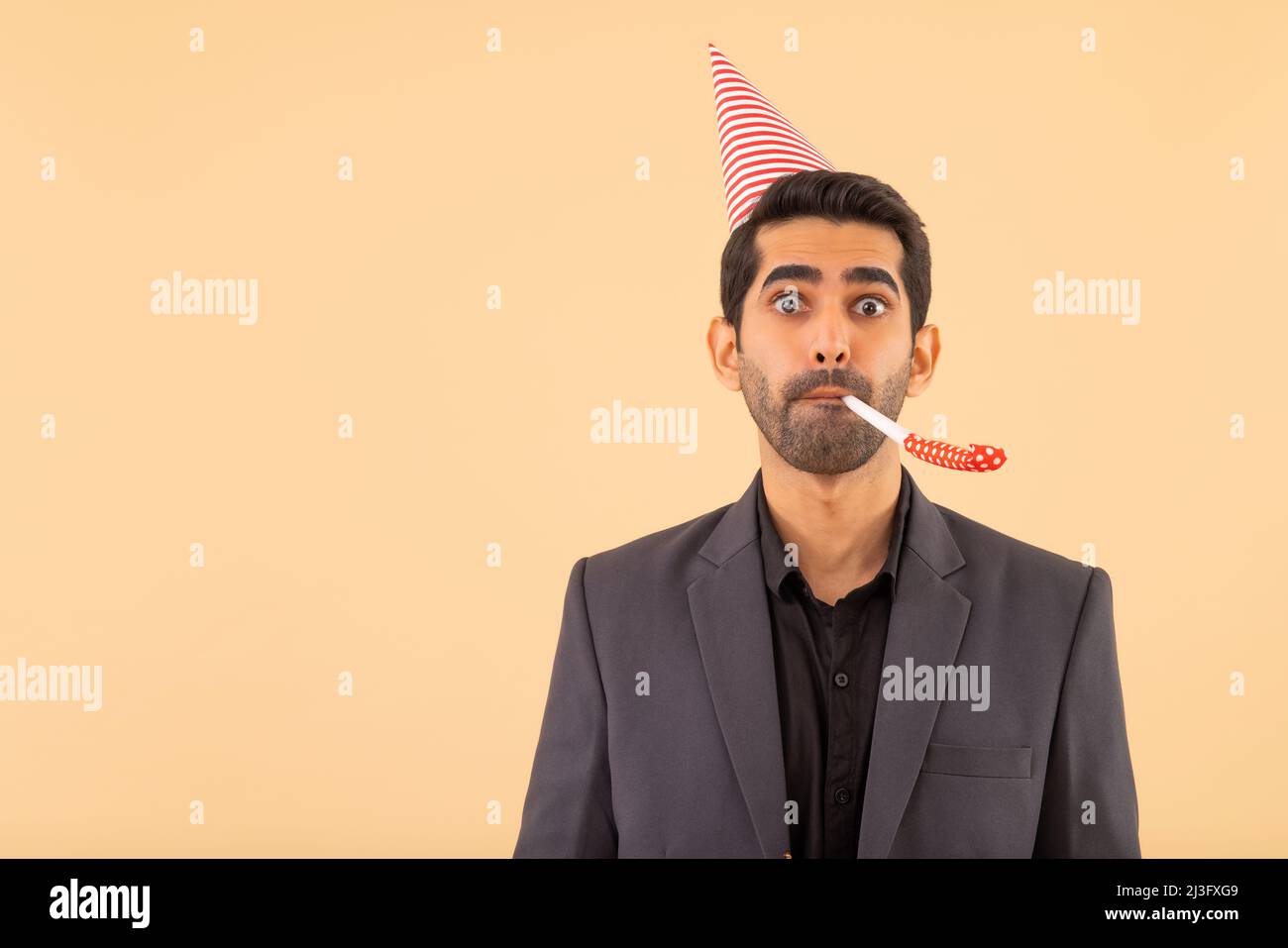 Asian business man wearing party hat Stock Photo - Alamy