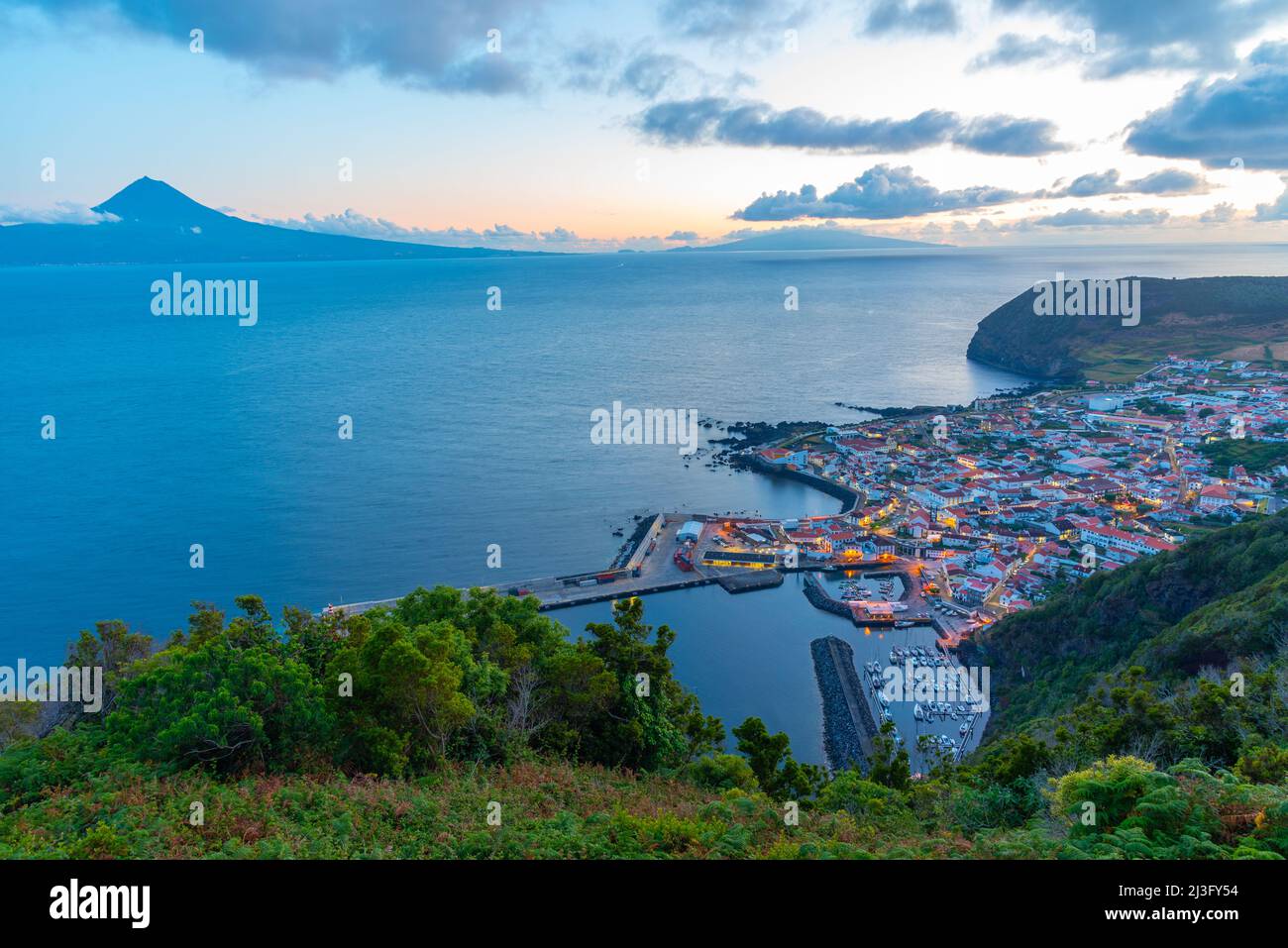 Sunset view of Velas town at Sao Jorge island in Portugal Stock Photo ...