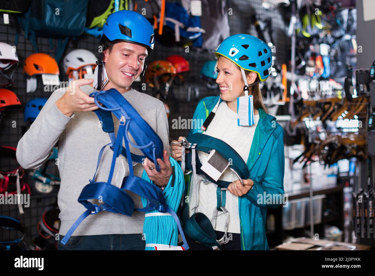 Athletes chooses climbing equipment Stock Photo - Alamy