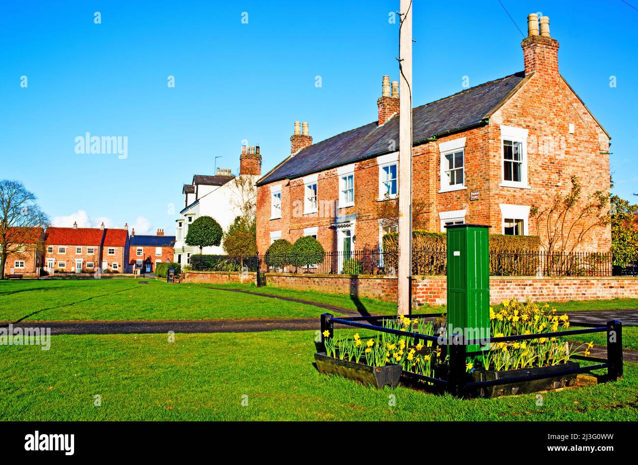 Village water pump and Manor Farm house, Upper Poppleton, North ...
