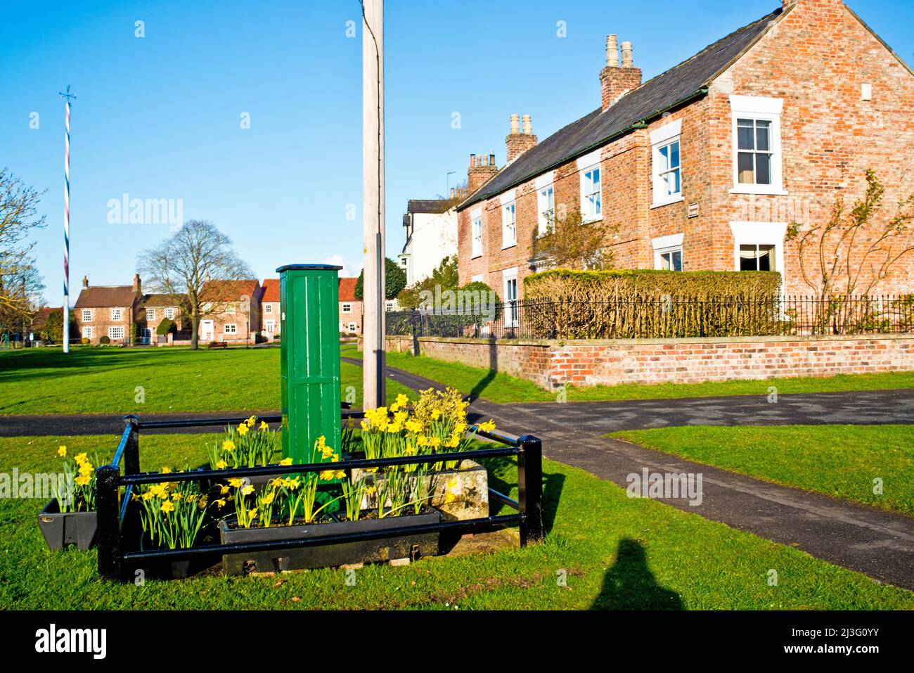 Village water pump and Manor Farm house, Upper Poppleton, North ...