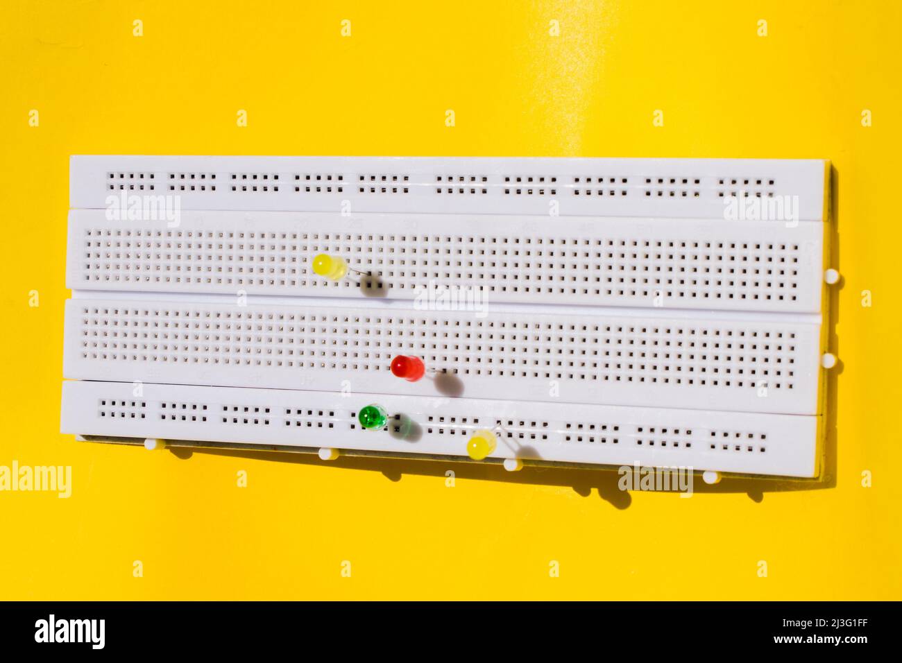 Light emitting diode or LED on a electronic breadboard for projects in ...