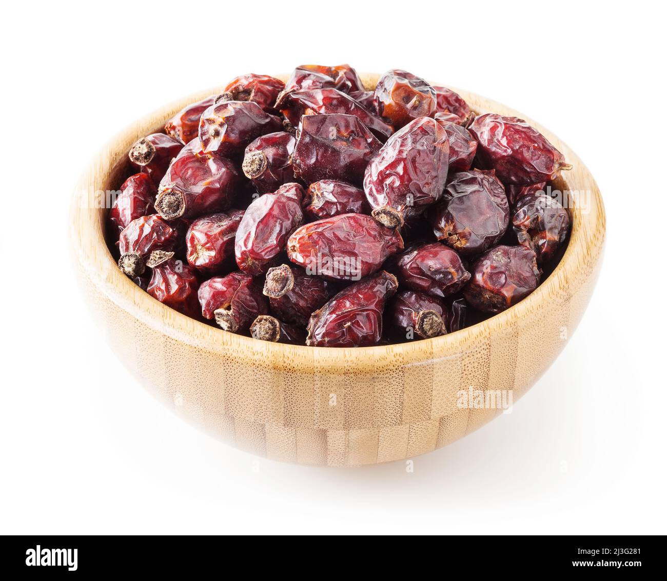 Dried wild rose berries in wooden bowl isolated on white background ...