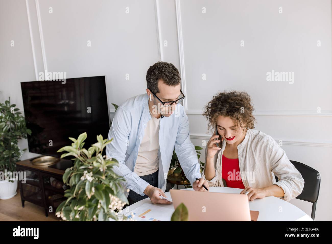 Successful stylish business partners working on project in modern ...