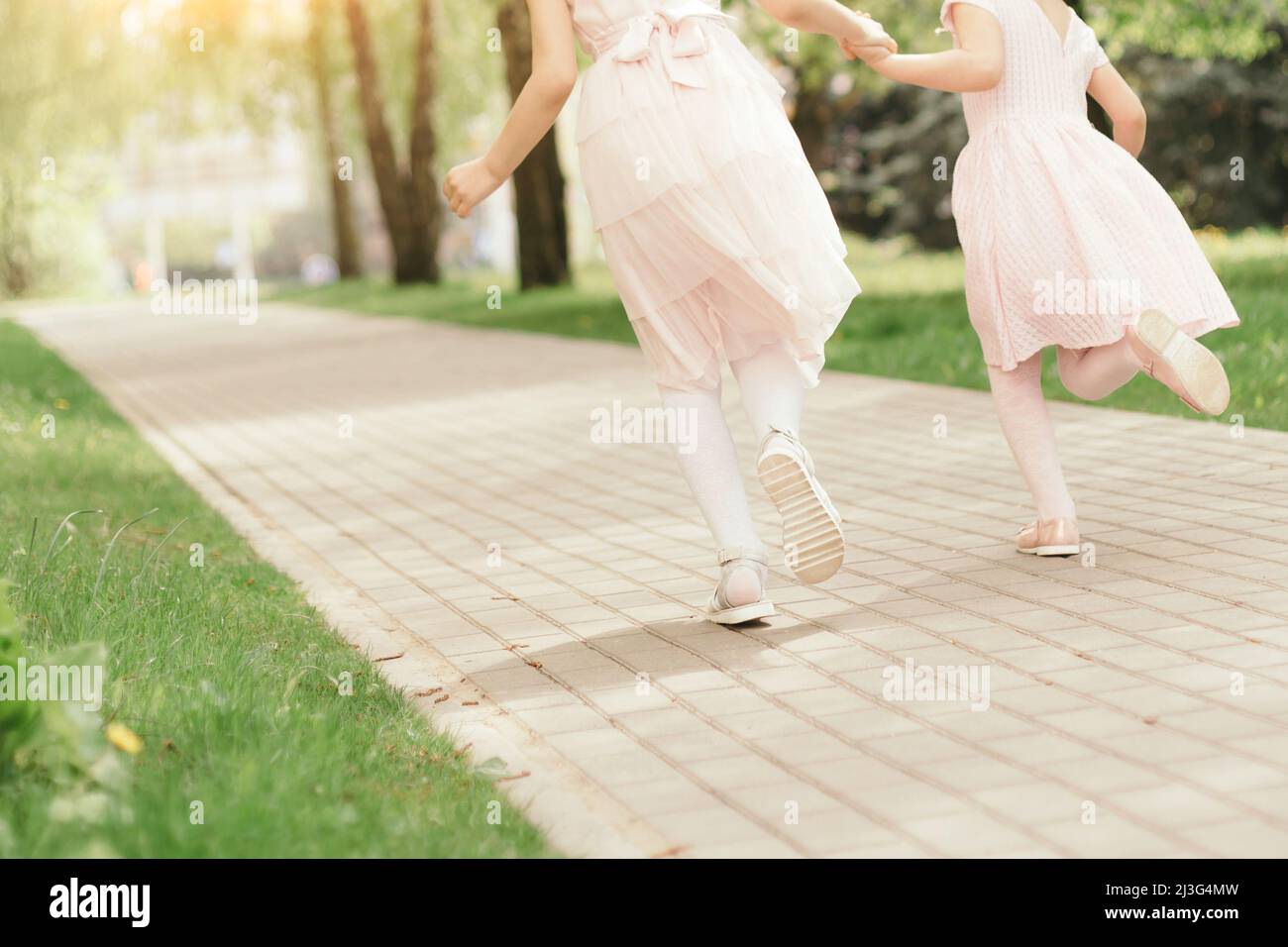 feet of girls running on the trail. two little girls are running Stock ...