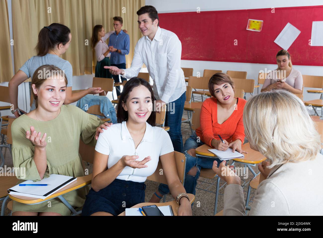 Students communicating during recess Stock Photo - Alamy